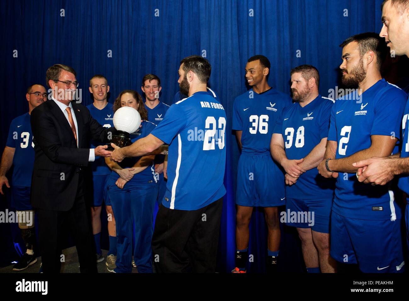 Secretary of Defense Ash Carter presents the trophy to Team Air Force ...