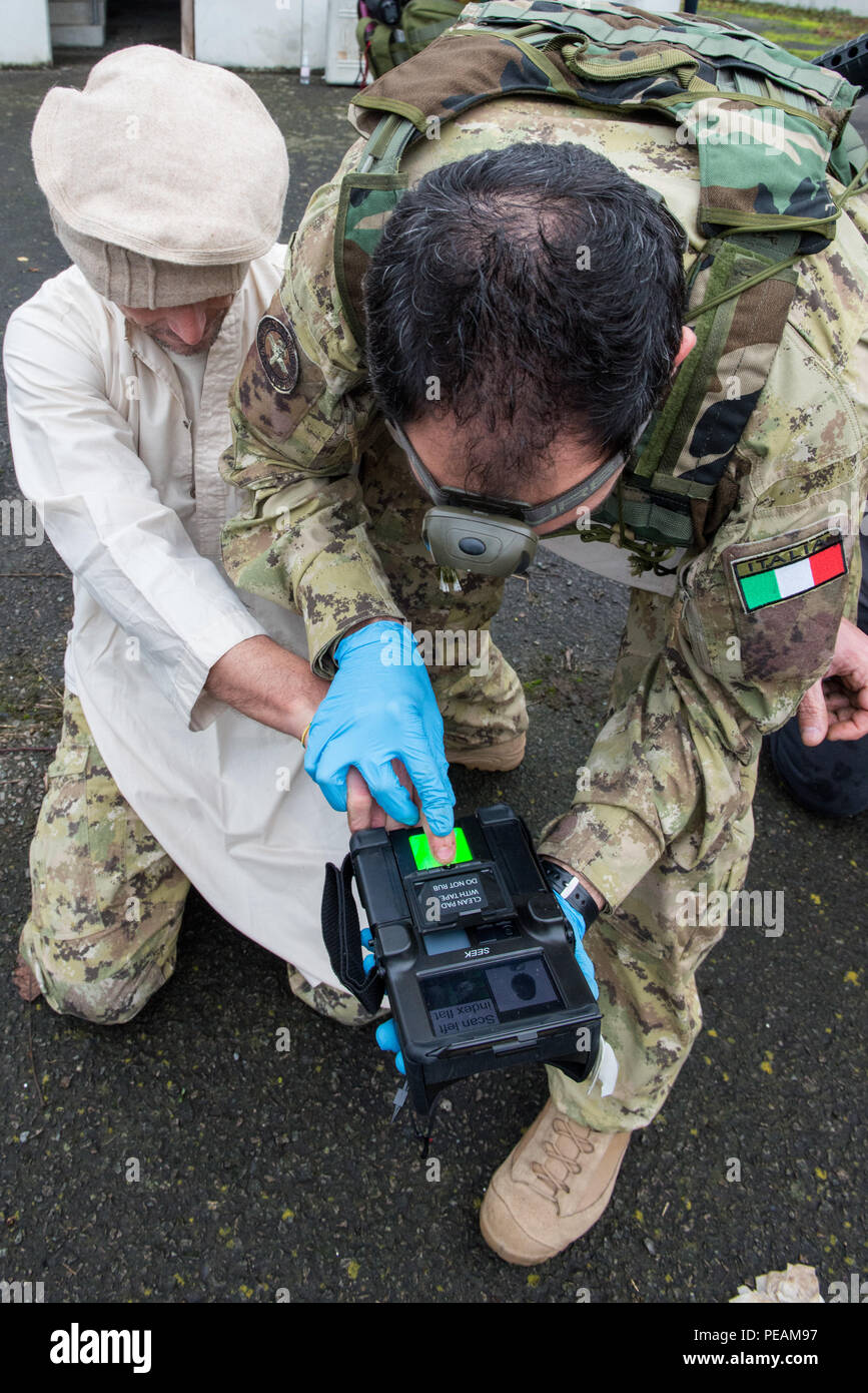 A member of the Italian 9th Special Forces Unit checks the fingerprints ...