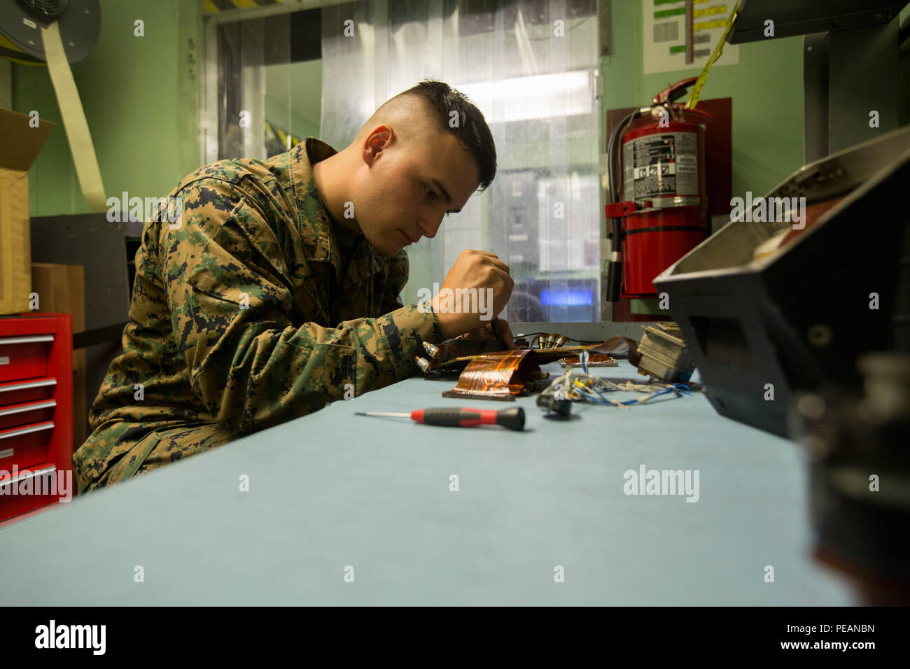 U.S. Marine Corps Lance Cpl. David E. Hamric, an advanced maintenance ...