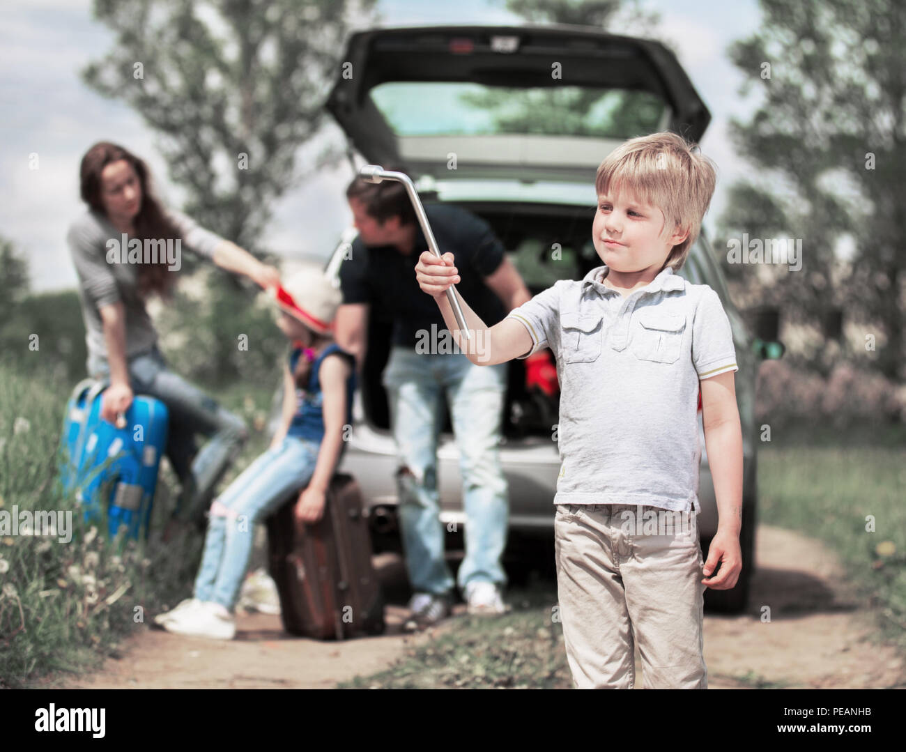 Fun friendly family is on a picnic. A car breakdown Stock Photo - Alamy