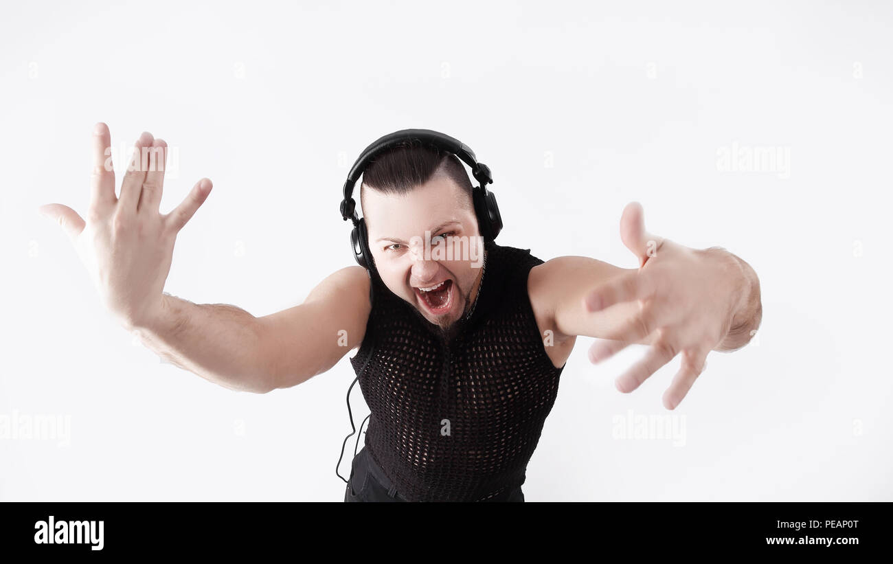 view from the top.cool male rapper in headphones watching the camera ...