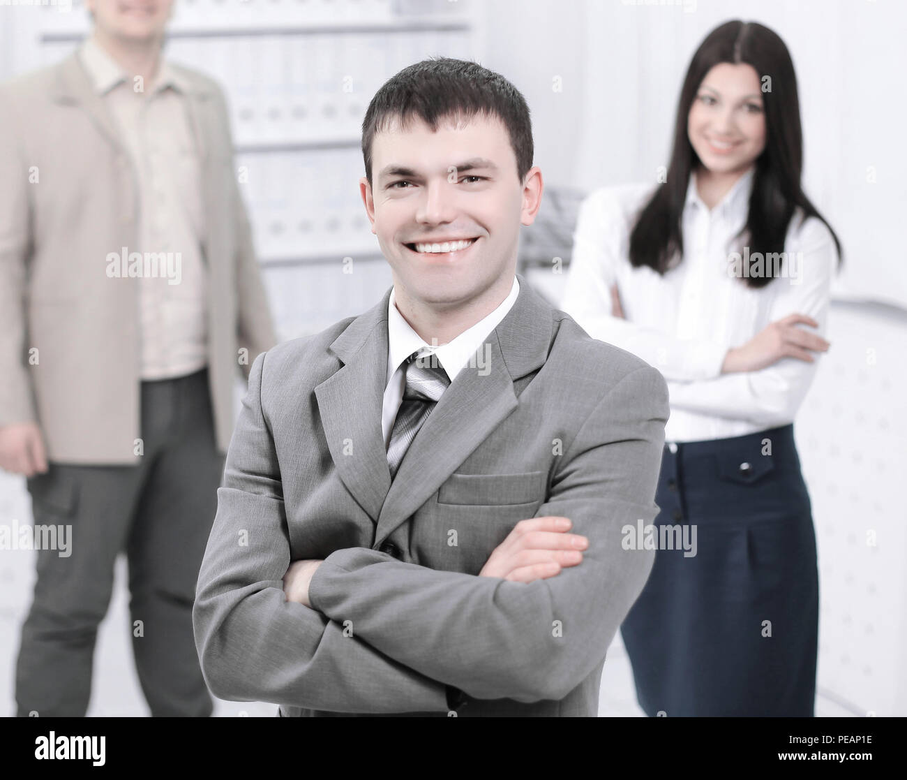 portrait of a young office employee , on the background of the Stock ...