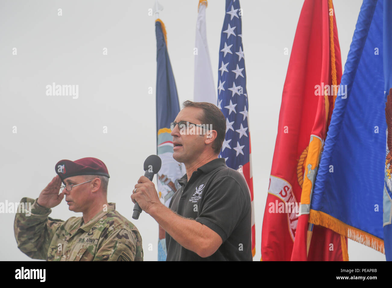 U.S. Chief Warrant Officer 5 Robert Pitts III, left, salutes while the ...