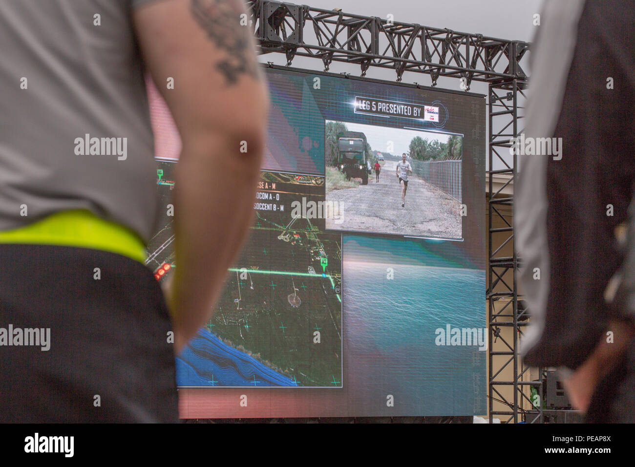 Participants and volunteers watch live streaming of the 35th Annual ...