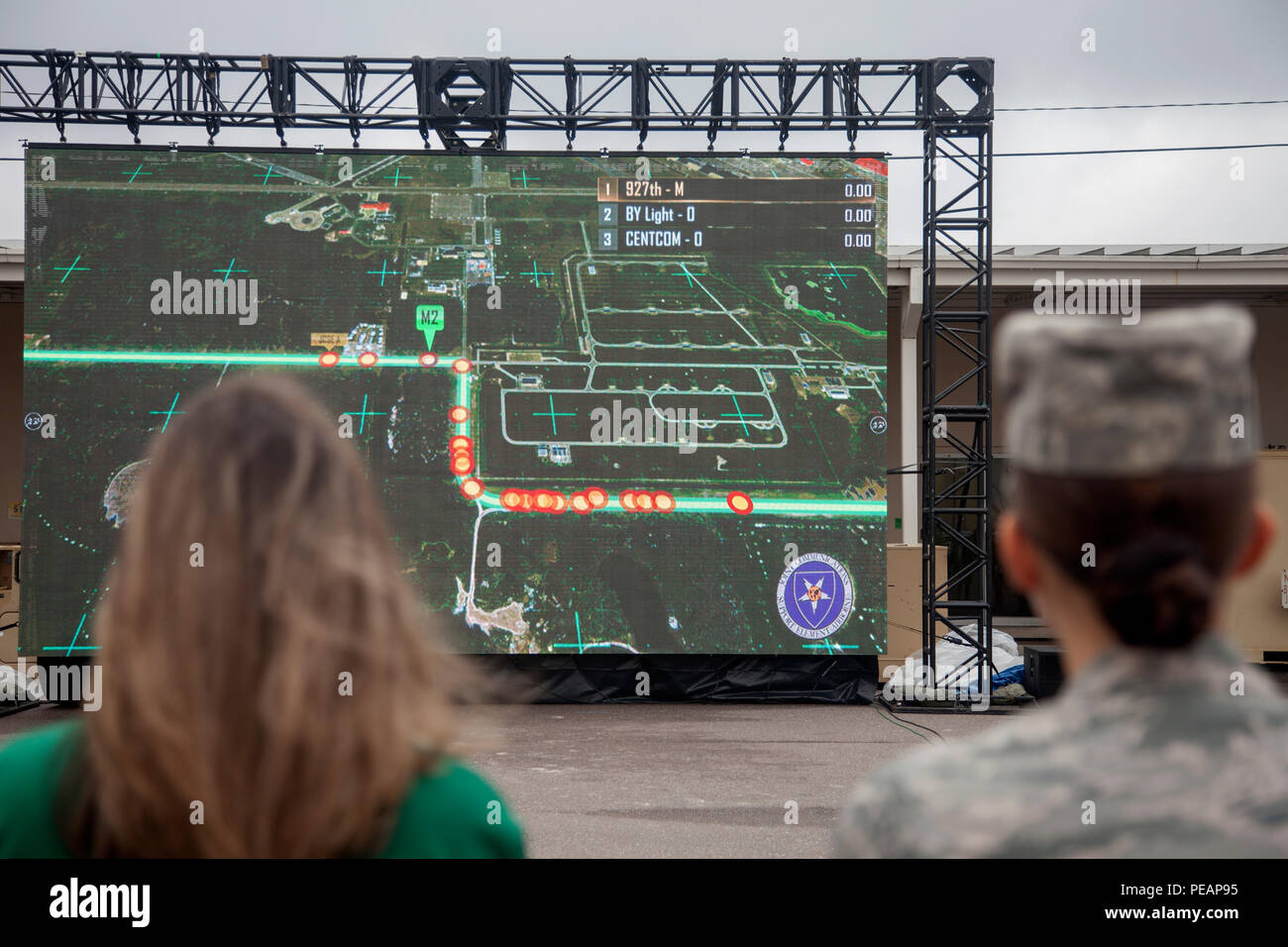 Participants and volunteers watch live streaming of the 35th Annual ...
