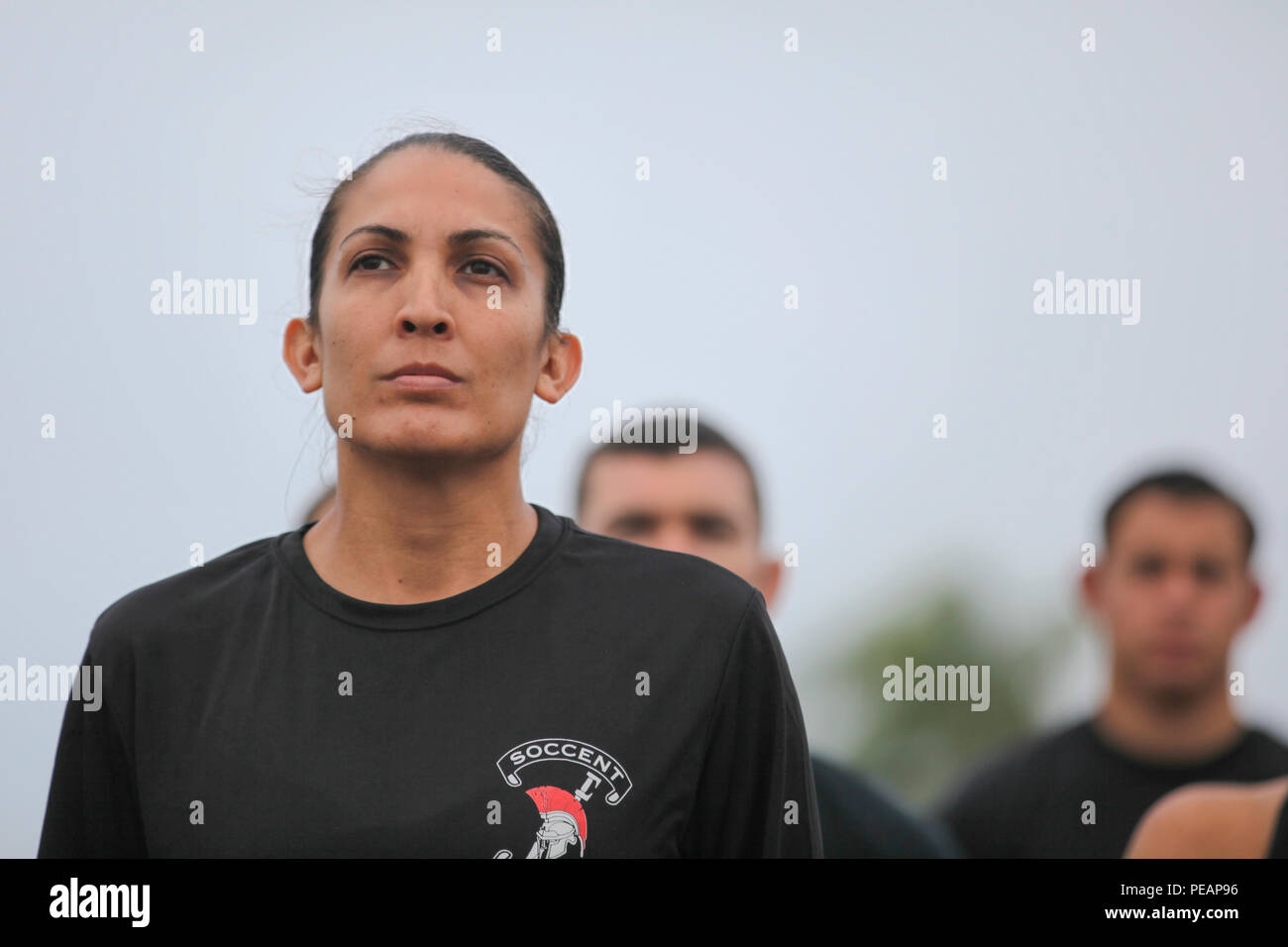 Participants and volunteers watch a memorial video during the opening ...