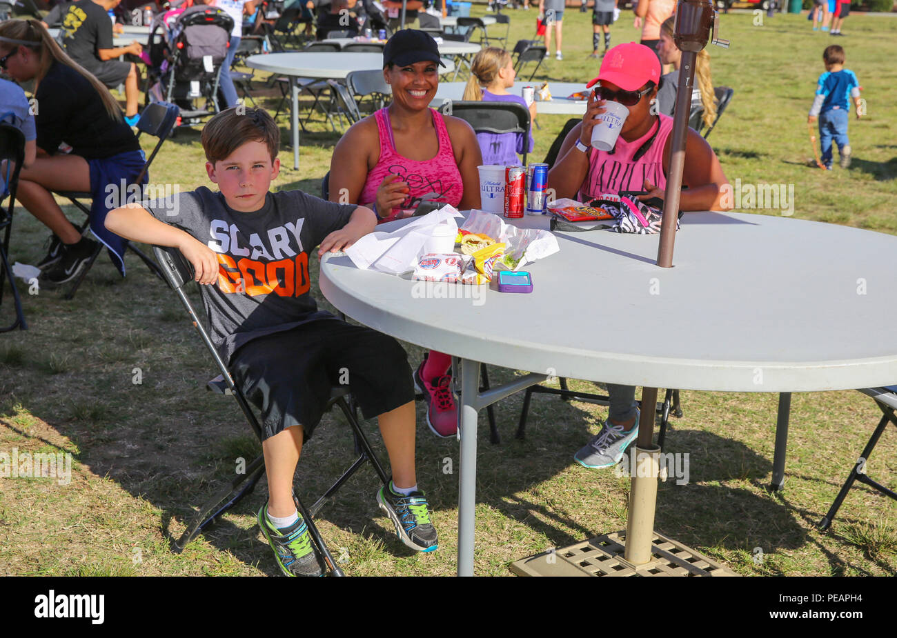 Participants look for a place to sit and relax after running in the ...