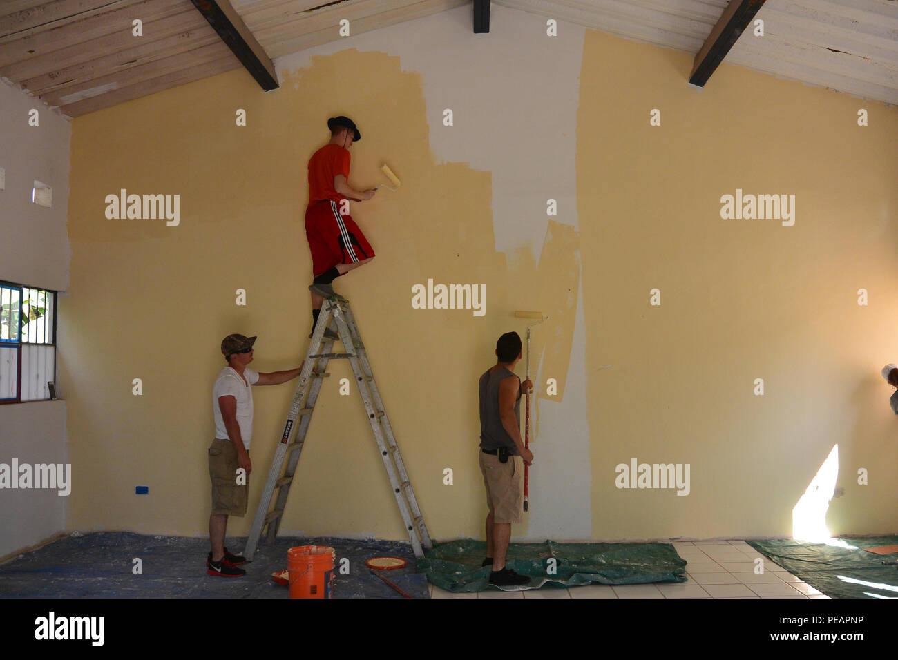 Seaman Brandon Mattingly (left), Fireman Austin Aldana (on ladder) and ...