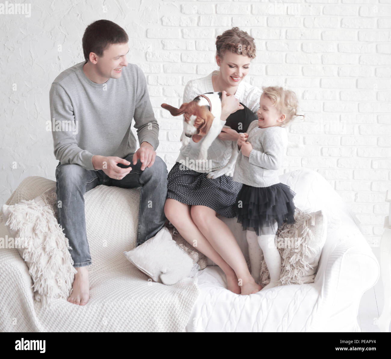 portrait of happy parents with their daughter and beloved pet with a ...