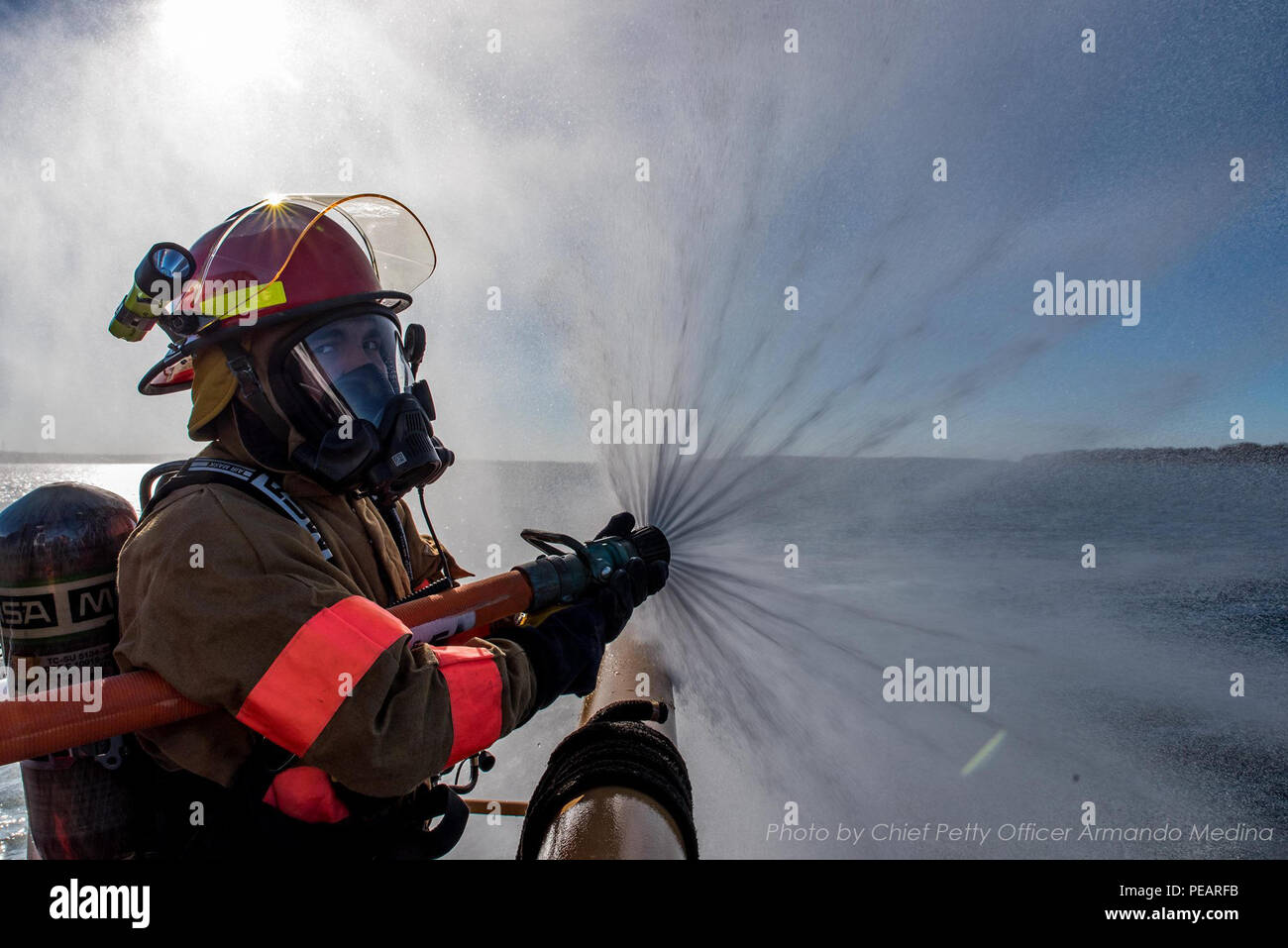 Seaman Anthony Fritz conducts firefighting training aboard the Coast ...