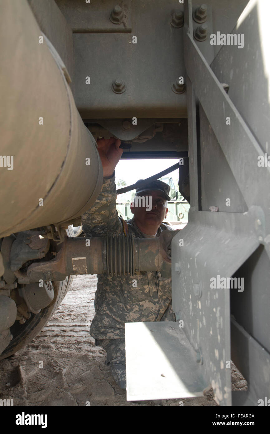 Sgt. Anthony Collins, 1221st Route Clearance Company, checks the ...