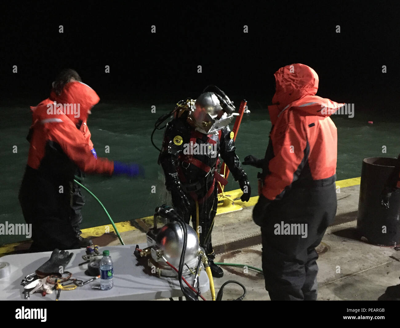 A T&T Salvage Inc. diver, wearing a positive pressure dive suit ...