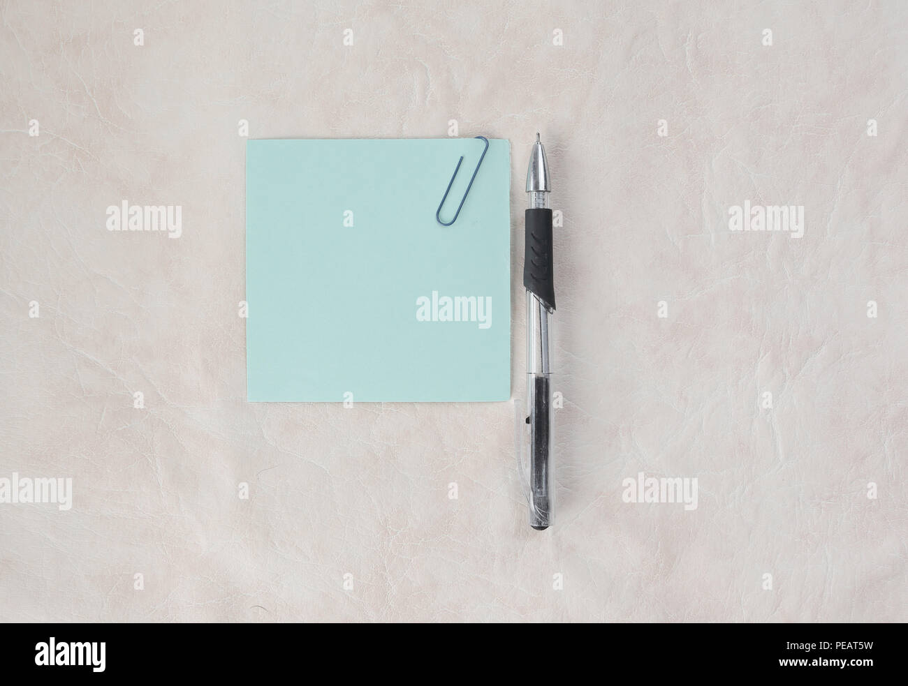 blue sheet of paper for notes and pen on paper background Stock Photo ...