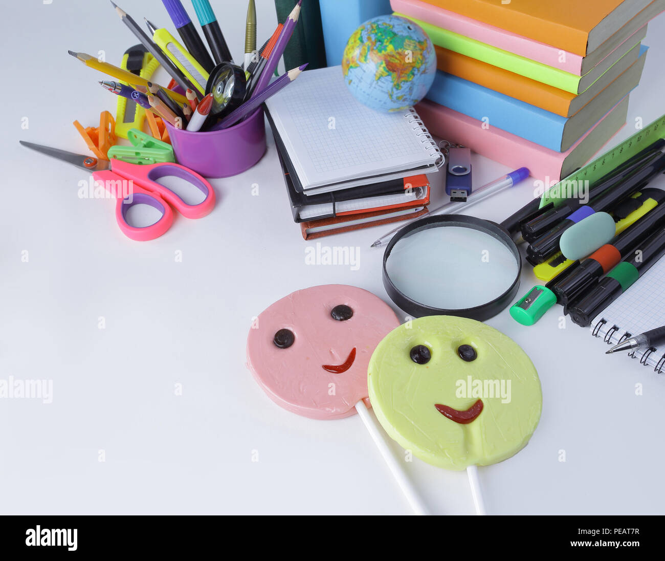 two candy and school supplies on a white background Stock Photo - Alamy