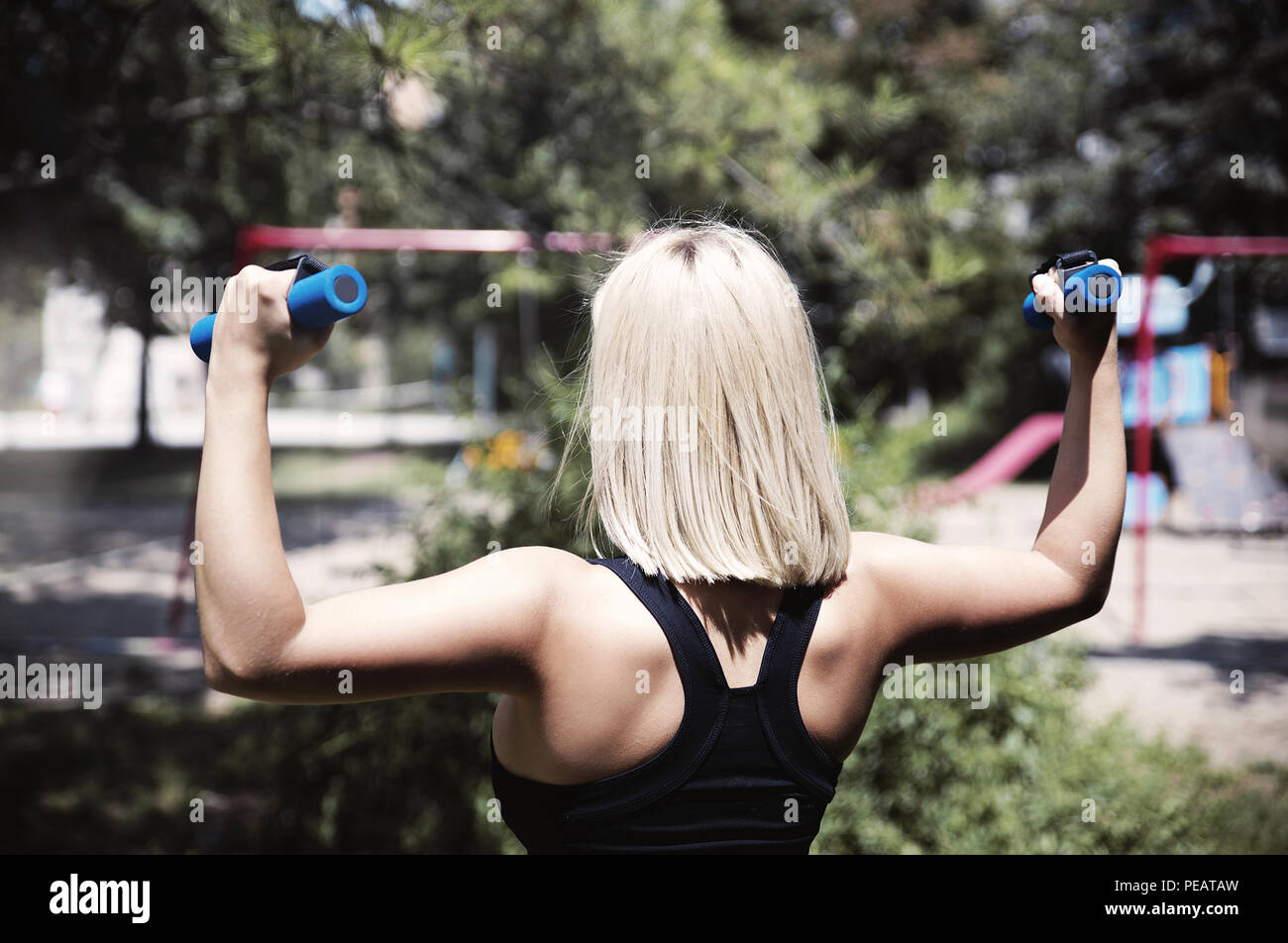 Woman arm exercise weights hi-res stock photography and images - Alamy
