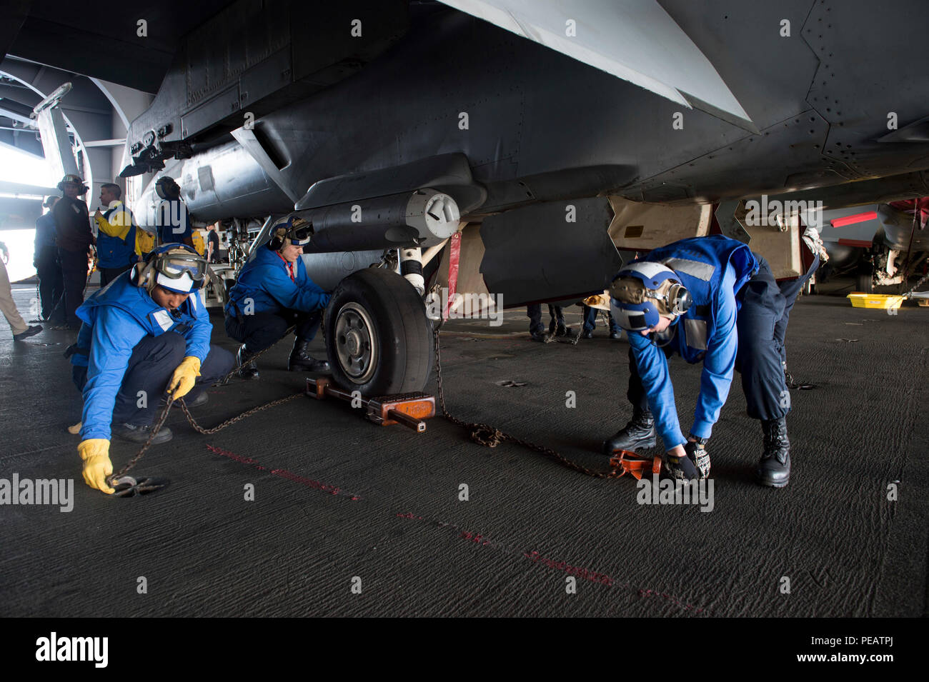 151127-N-KK394-057 ATLANTIC OCEAN (Nov. 27, 2015) - Sailors secure the ...