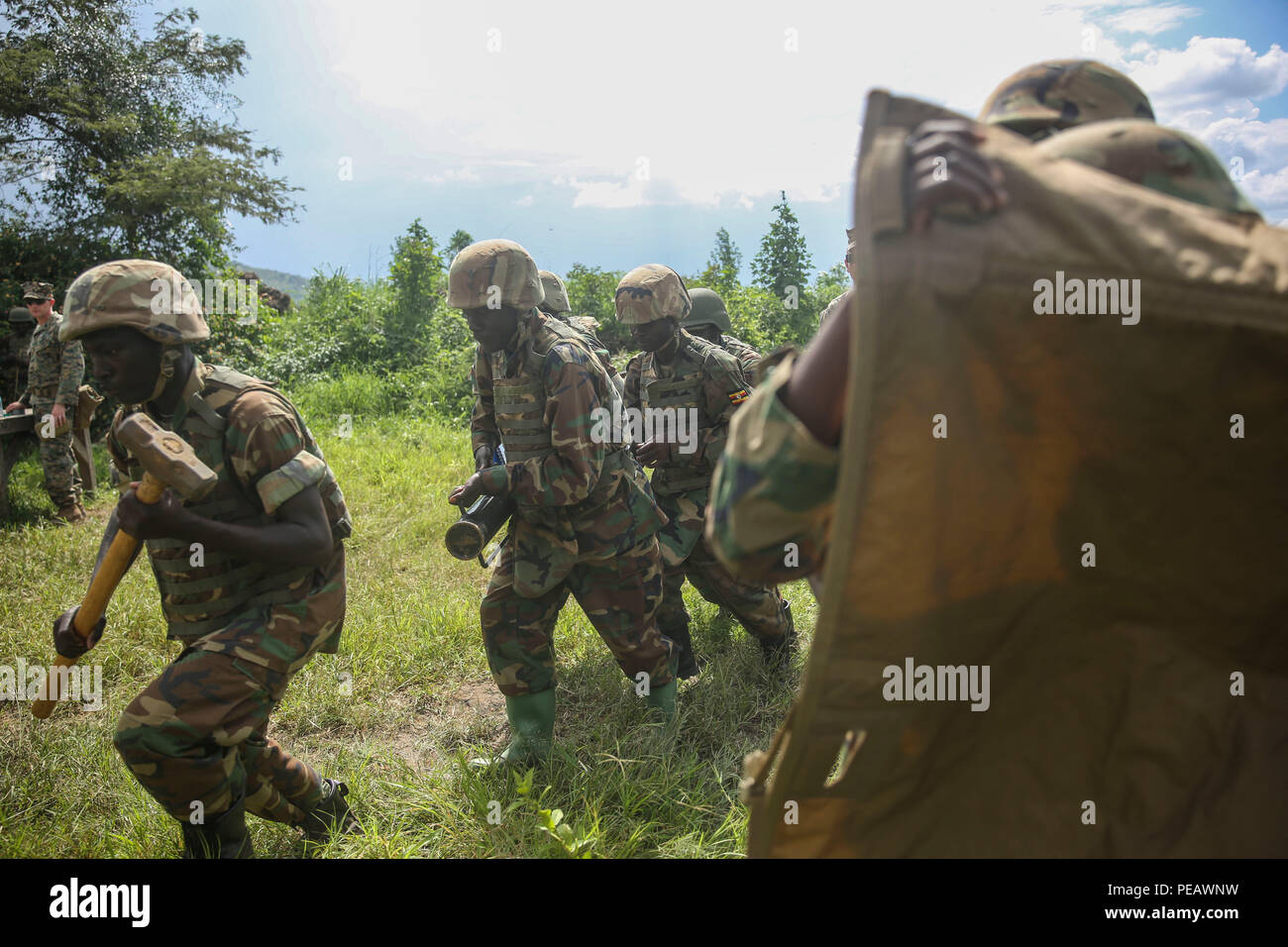 Uganda People’s Defense Force soldiers approach their entrance point ...
