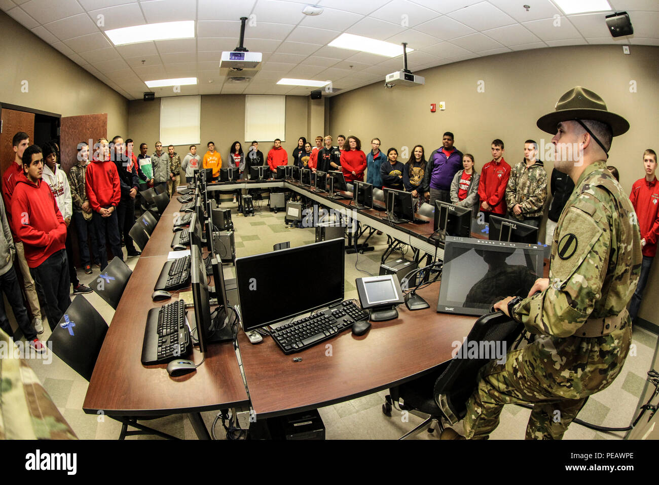 Sgt. 1st Class Eugene Serrano, USADSA drill sgt. leader, gives a tour ...