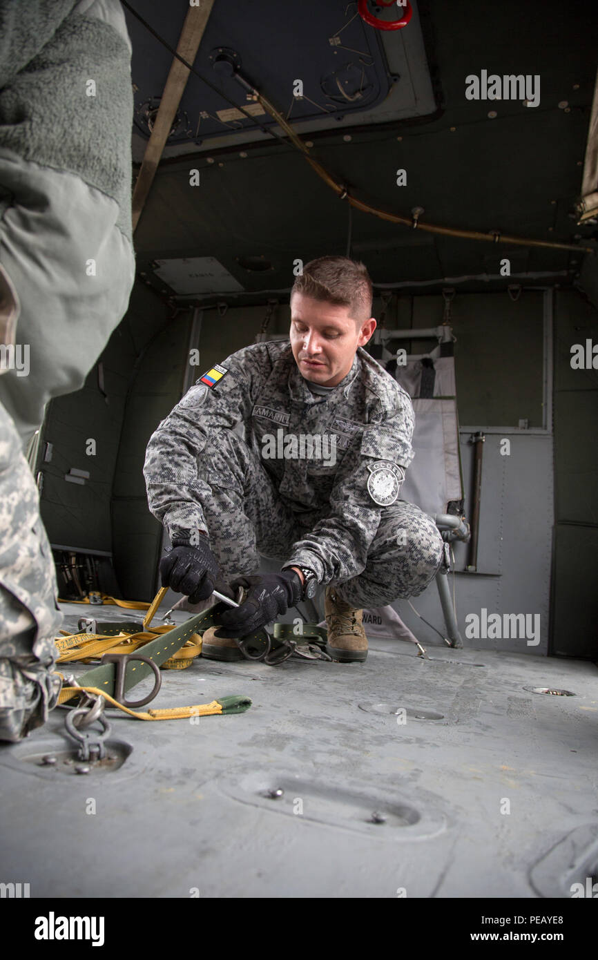 A Colombian jumpmaster performs jumpmaster duties aboard a UH-60 Black ...