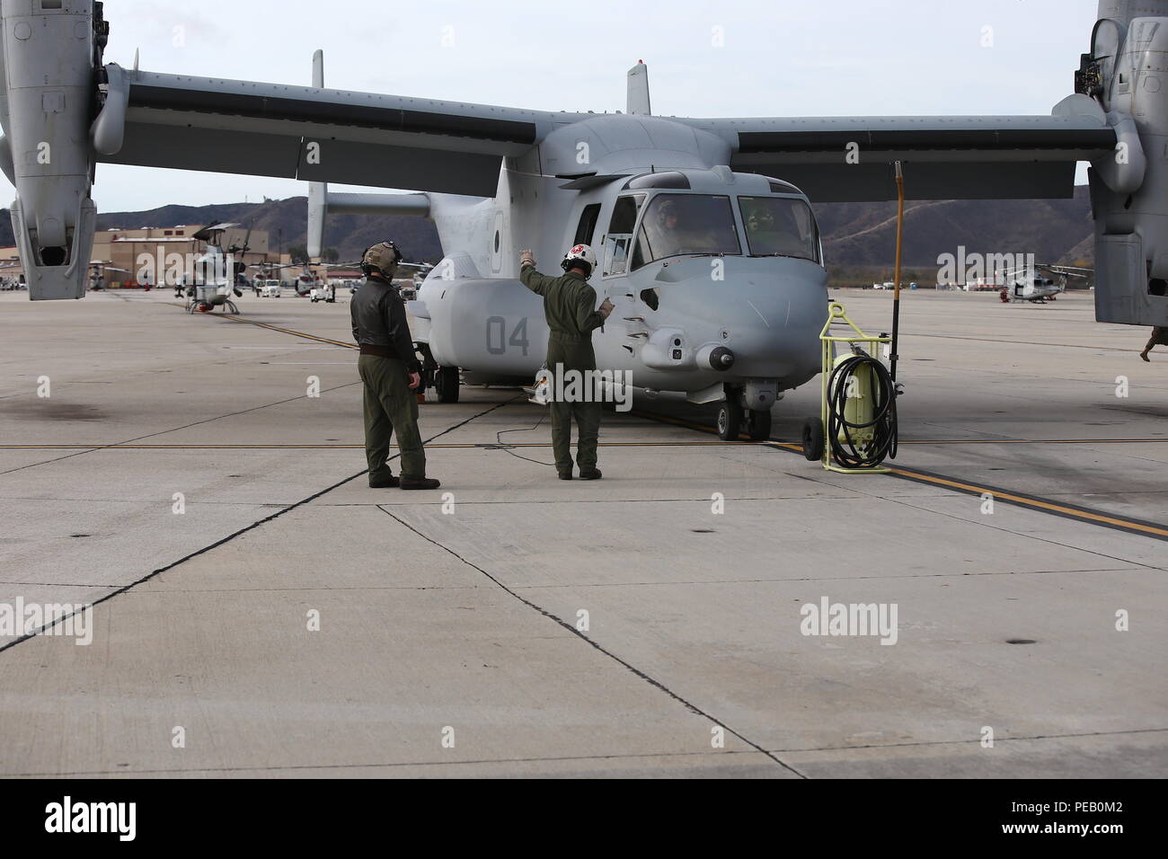 Aircrew members with the “Purple Foxes” of VMM 364 prepare for a five ...