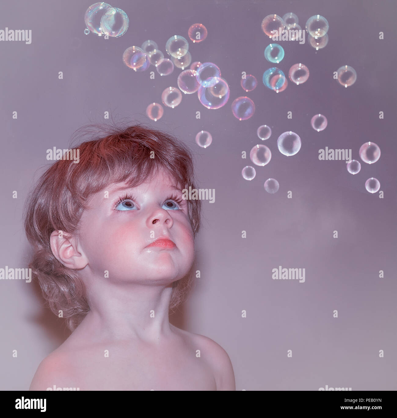 Young child counting bubbles Stock Photo - Alamy