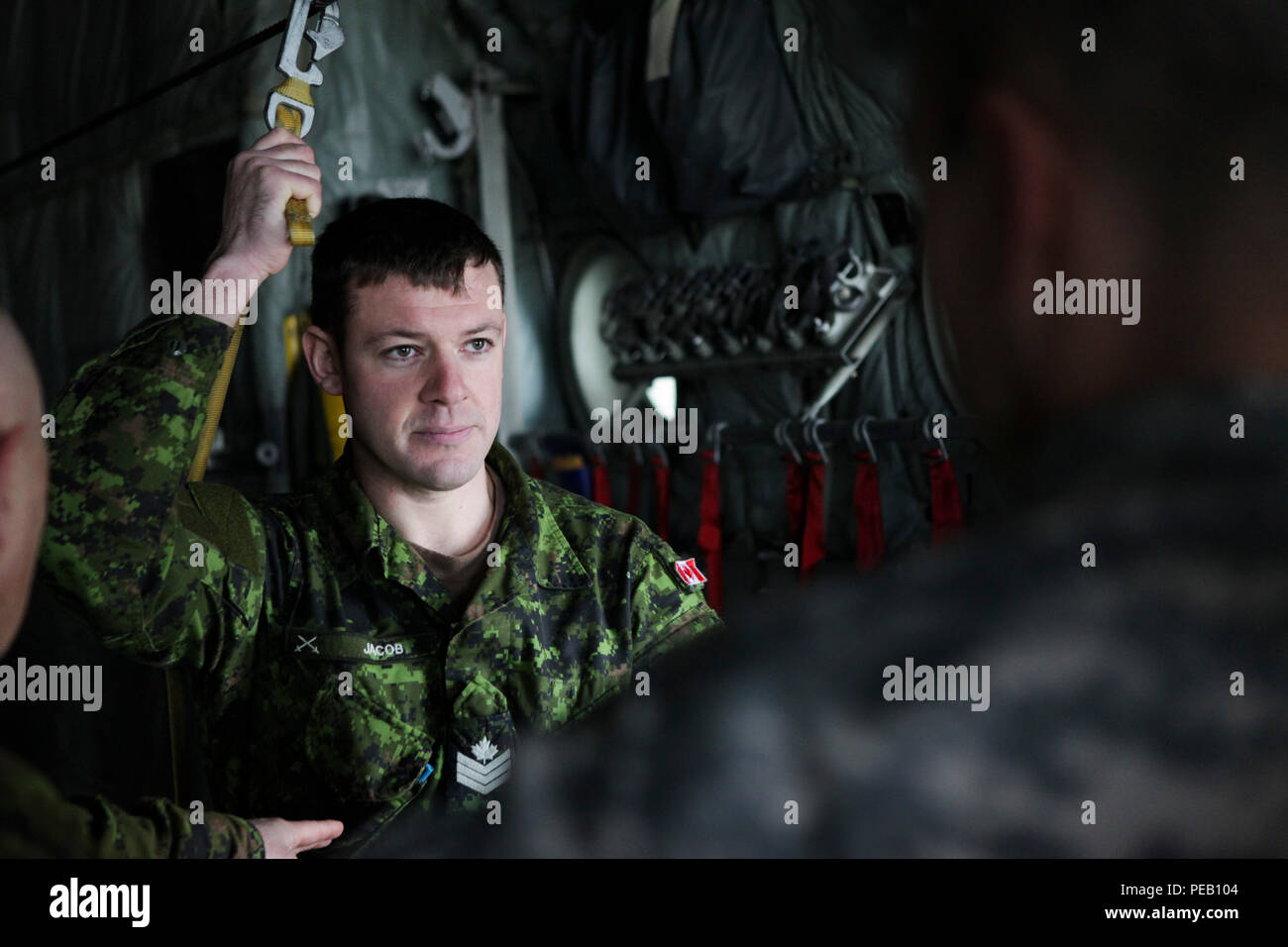 Canadian jumpmaster Staff Sgt. Zach Jacobs conducts static line safety ...