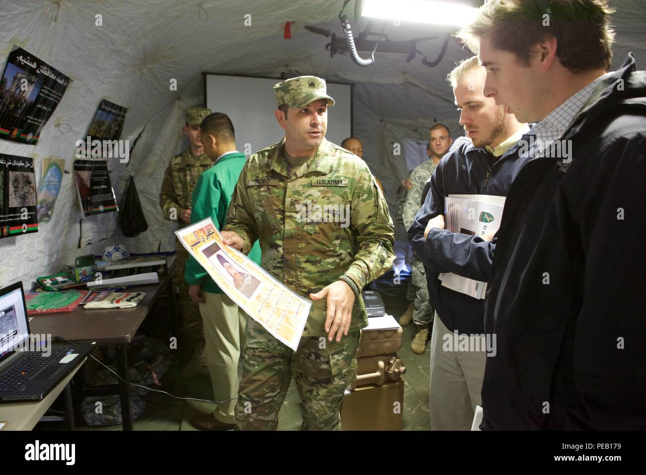 U.S. Army Sgt. Micheal Rizzo, 340 Tactical Psyop, briefs group of ...