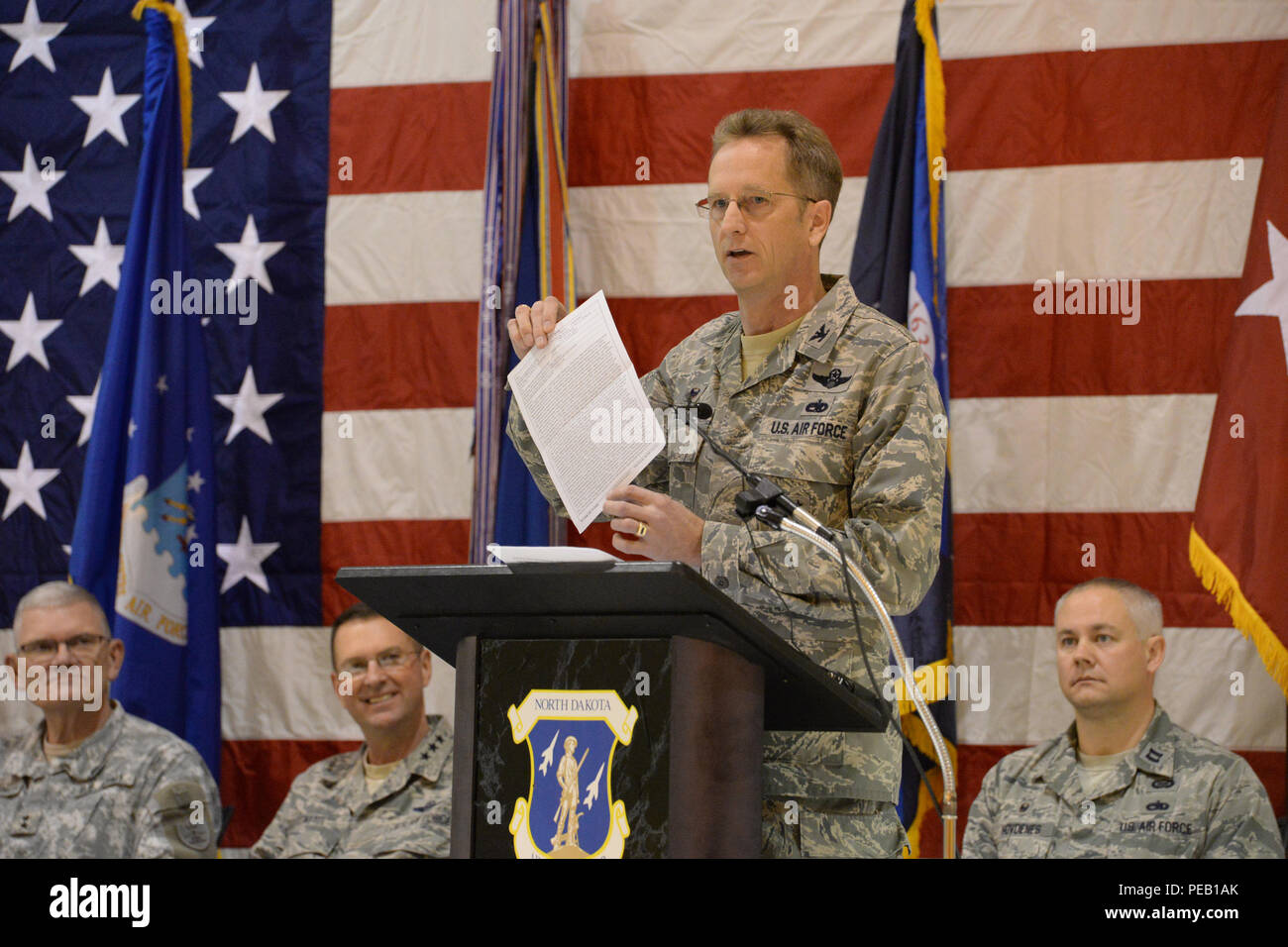 U.S. Air Force Col. Kent Olson, the 119th Wing commander, holds a list ...