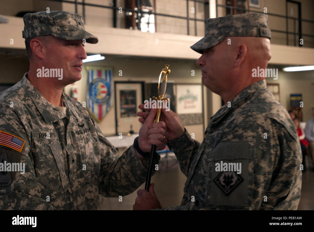 Command Sgt. Maj. Darrell L. Masterson (right) accepts the 66th Troop ...