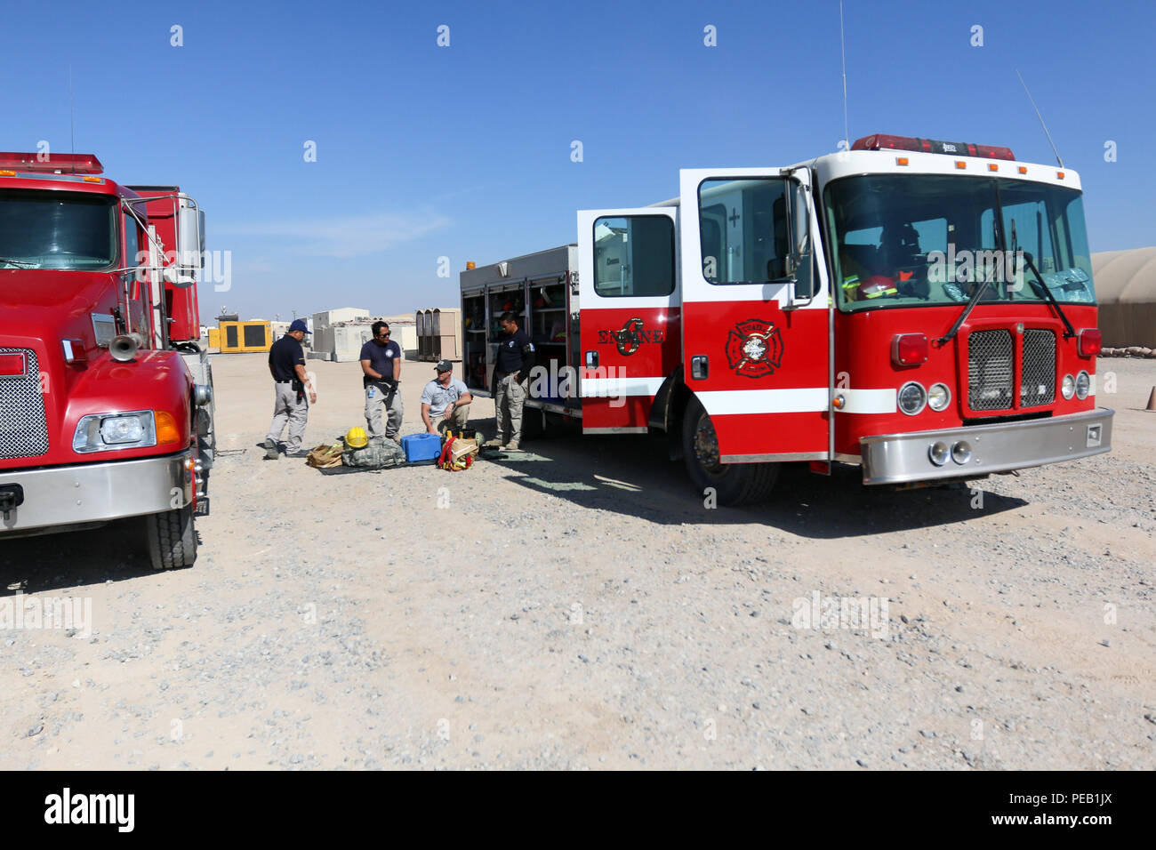 Fire Captain Tony Hamilton and three of his firefighters with Vectrus ...