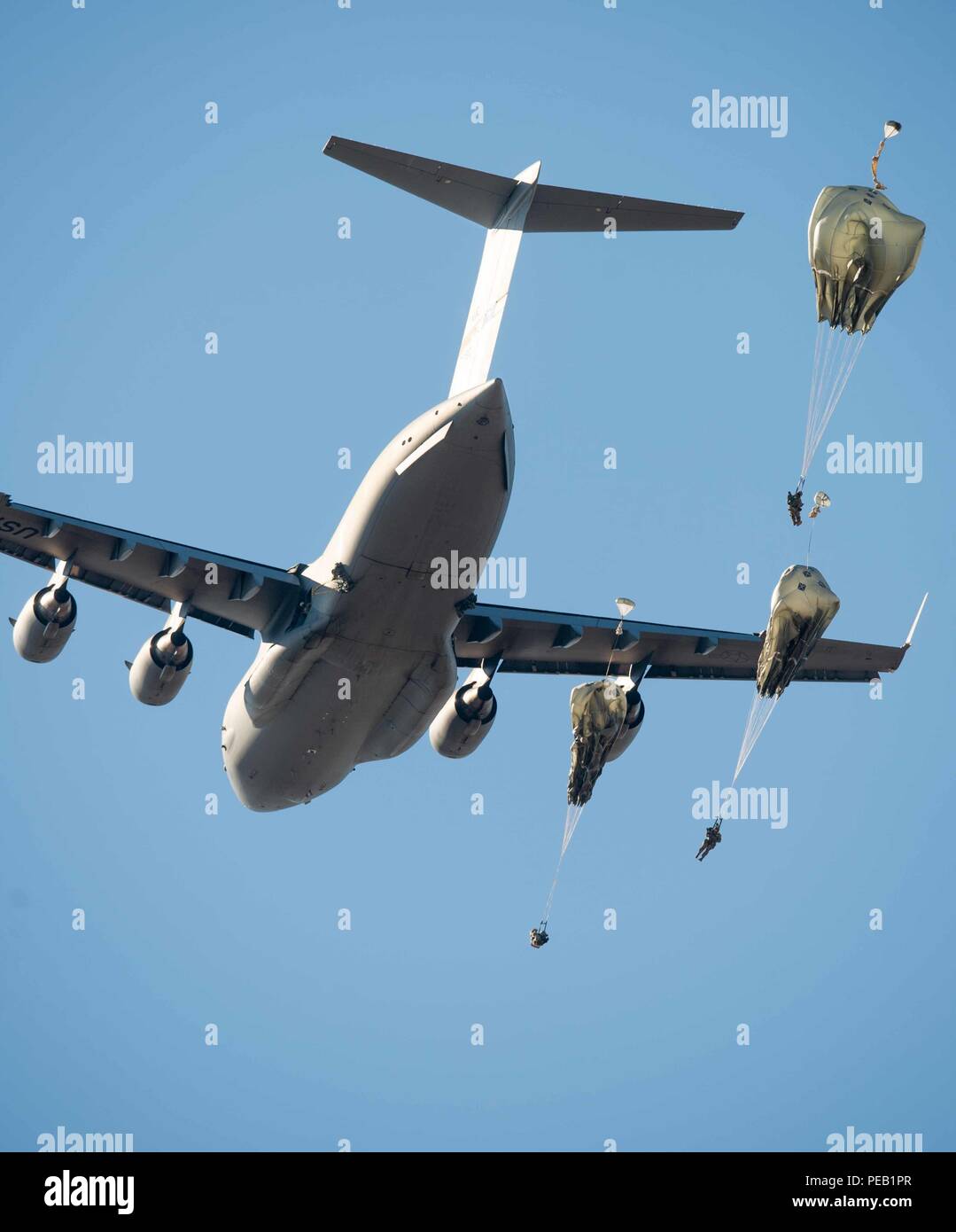 U.S. Army paratroopers assigned to the 82nd Airborne Division drop from ...