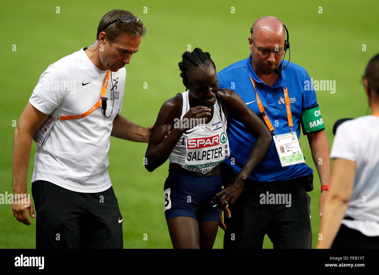 Israel's Lonah Chemtai (centre) appears distraught after the race on ...