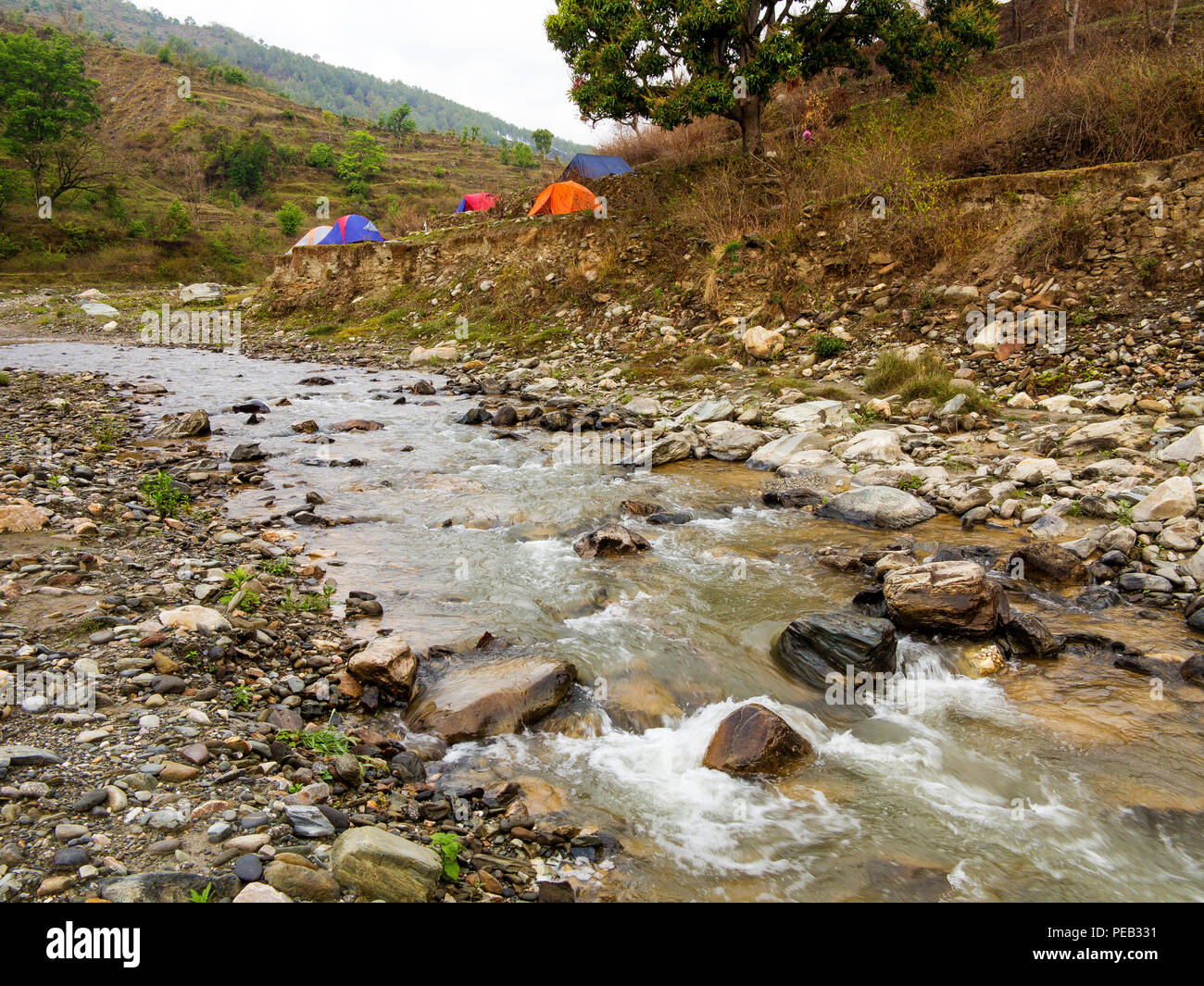 Camp at the shores of Panar River, Kumaon Hills, Uttarakhand, India ...