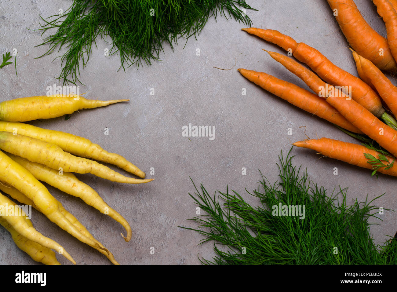 Food. Delicious harvested organic carrot on the grey table Stock Photo ...