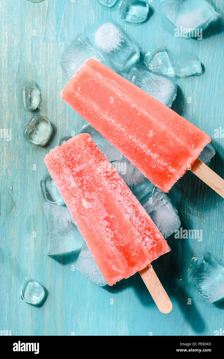 Delicious frozen sorbet on wooden background with ice cubes Stock Photo ...