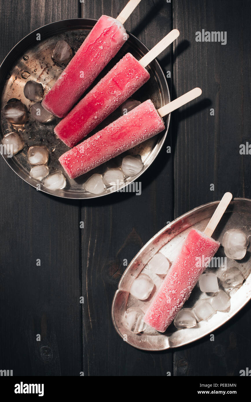 Frozen ice pop on wooden background Stock Photo - Alamy