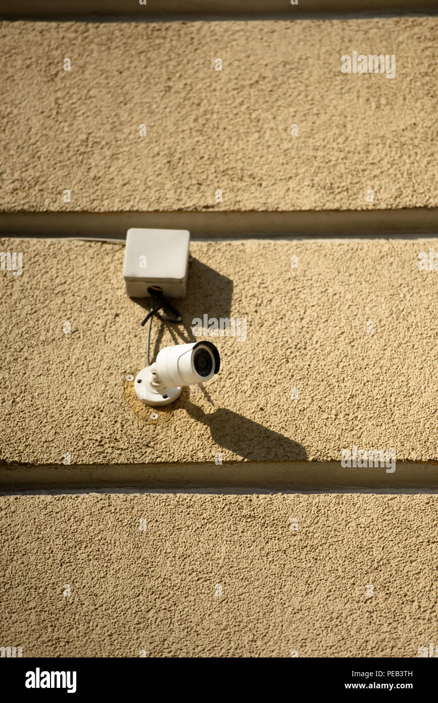 closeup shot of security camera on building facade in sunlight Stock ...