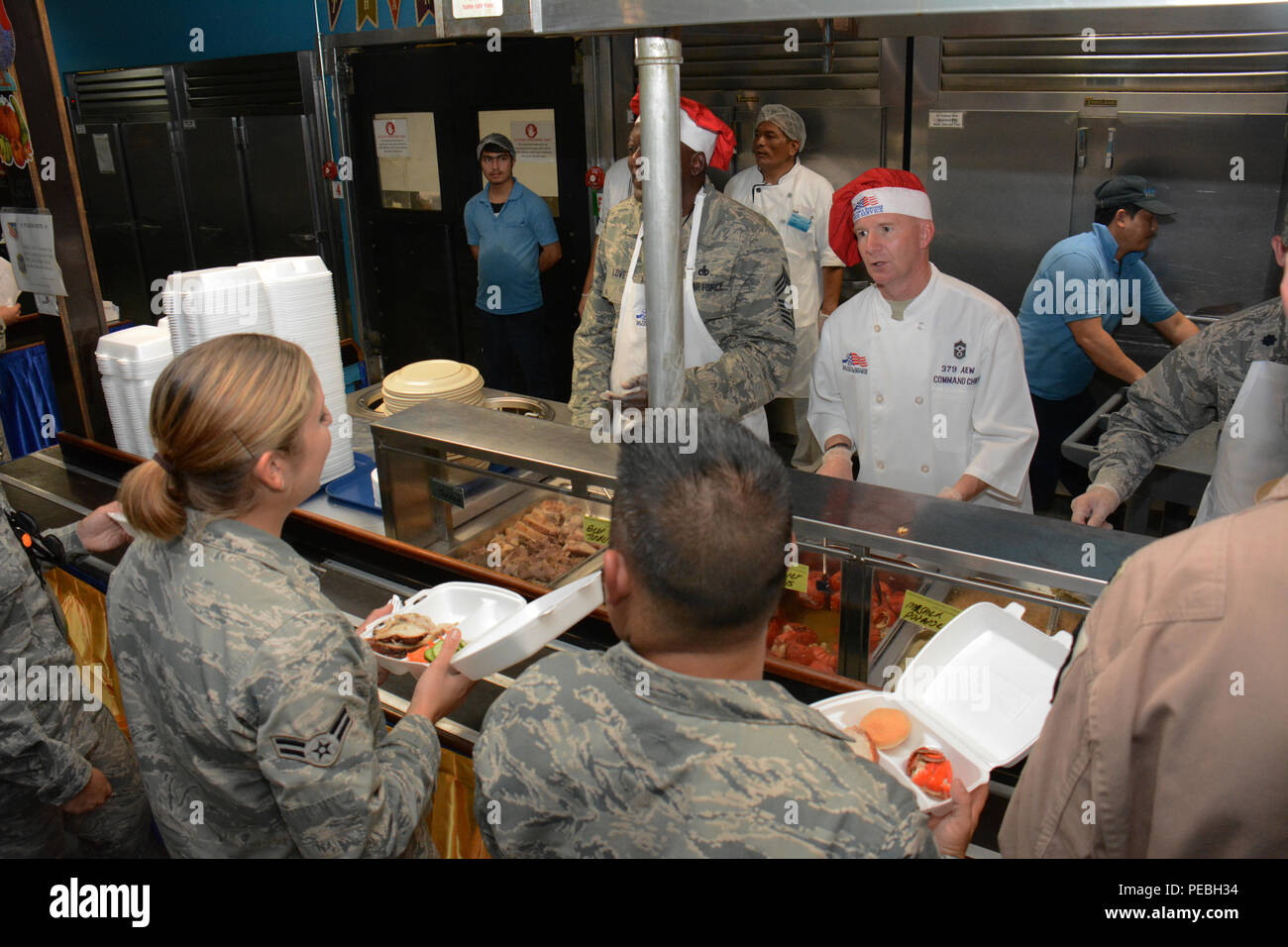 A senior United States Air Force enlisted leader serves cooked lobster ...