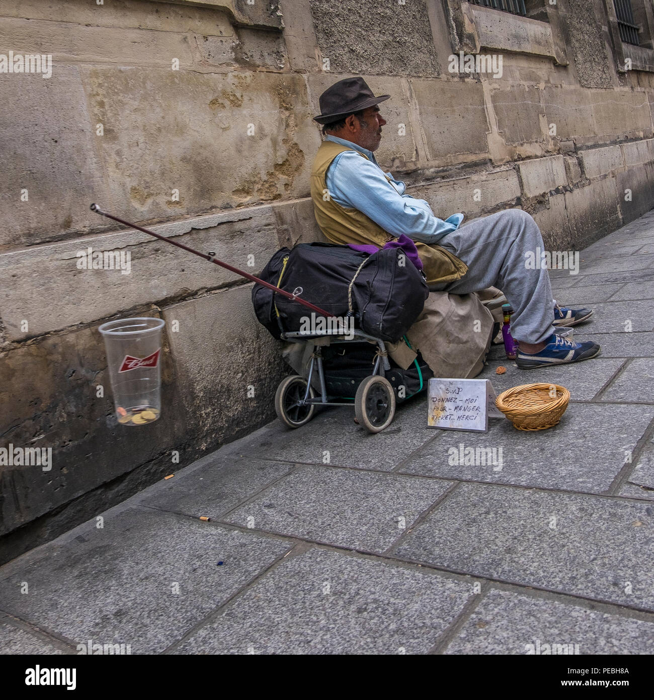 homeless man begging on streets of paris, france Stock Photo - Alamy