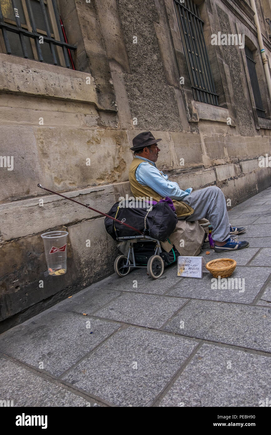 homeless man begging on streets of paris, france Stock Photo - Alamy