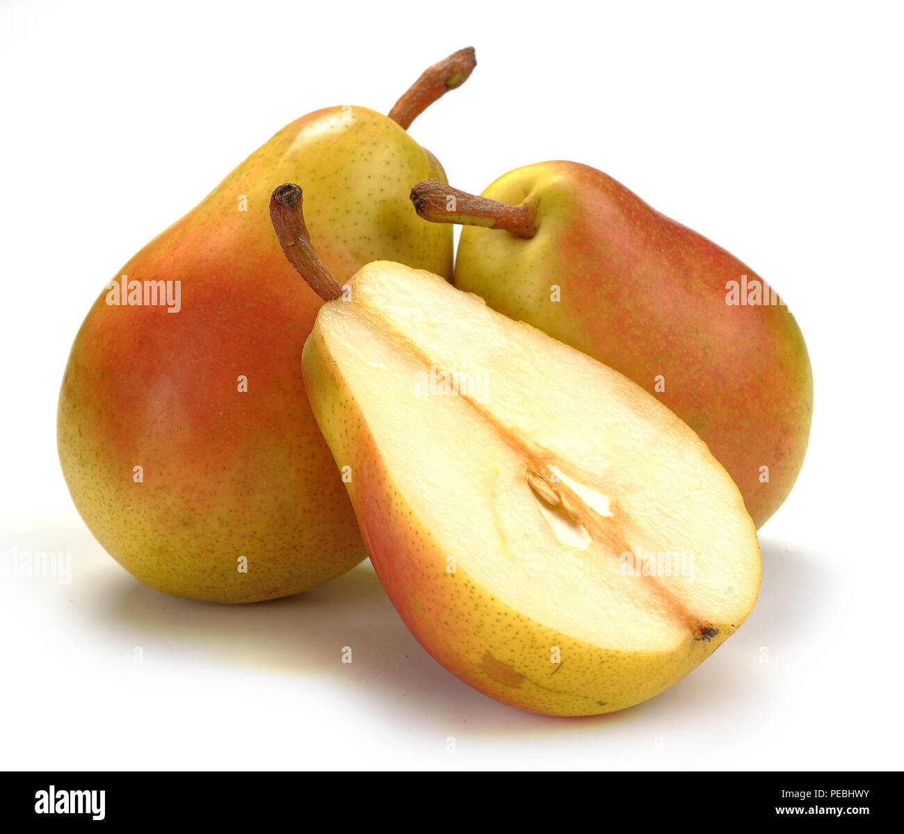 two pears in half on a white background Stock Photo - Alamy