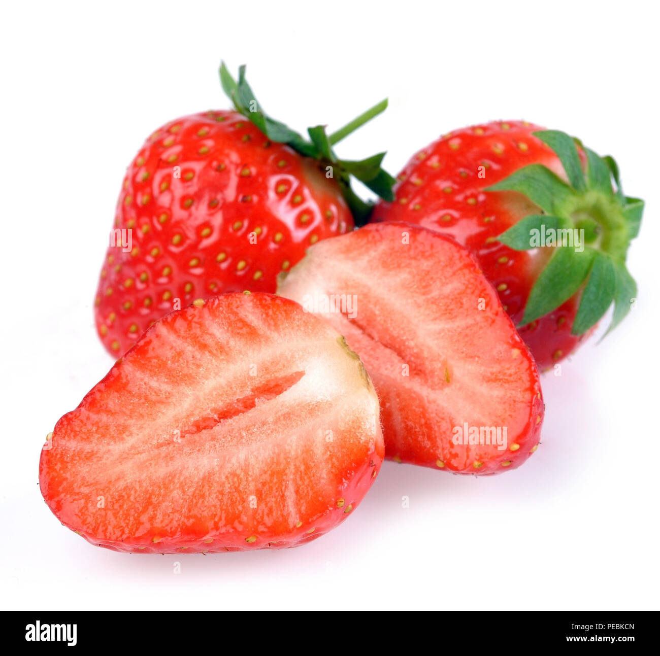 whole strawberry and half isolated on white Stock Photo - Alamy