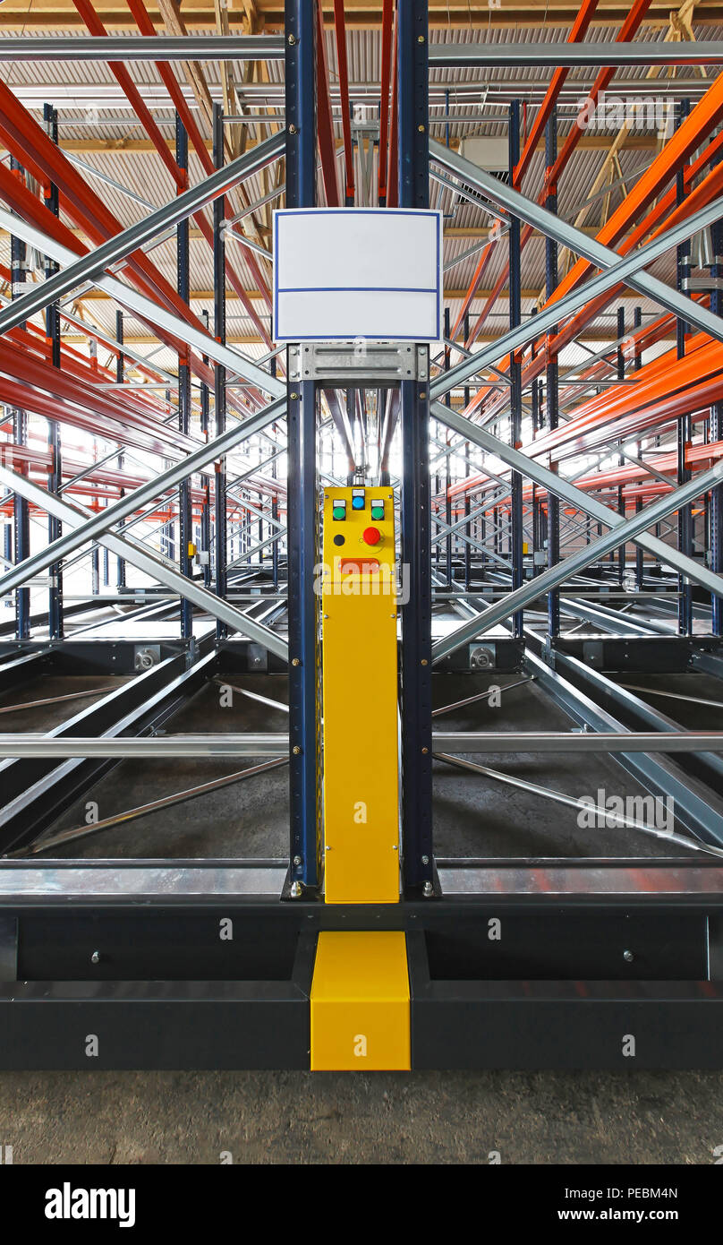 Power control of mobile shelving system in warehouse Stock Photo - Alamy