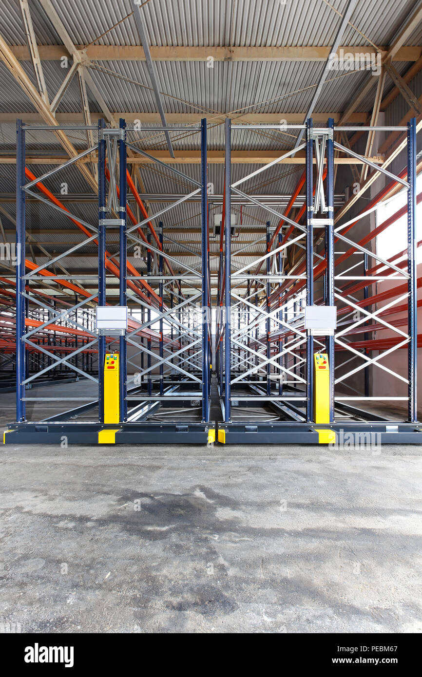 Mobile roller racking system in distribution warehouse Stock Photo - Alamy