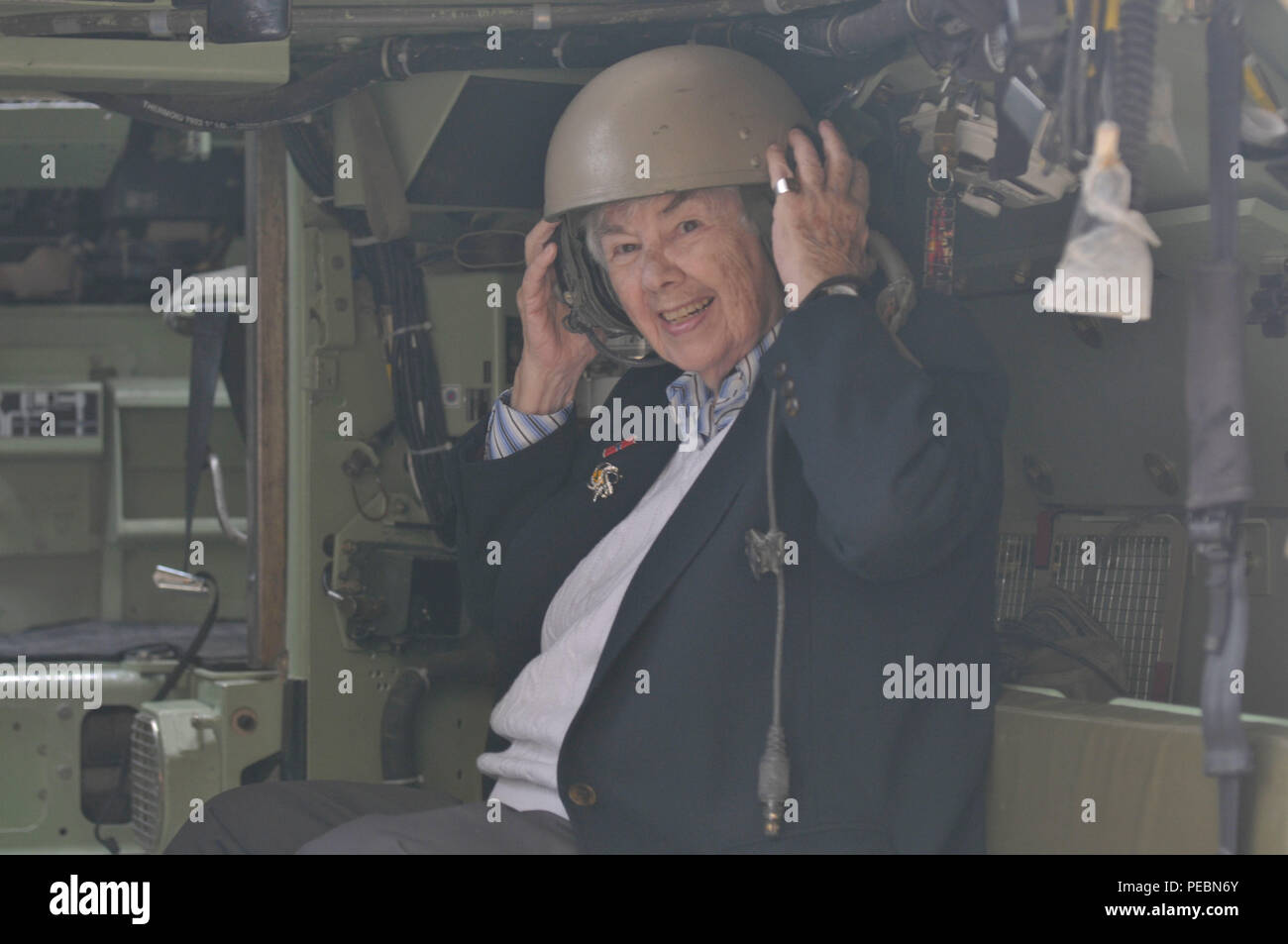 Sophy Haynes, a Gold Star Mother, tries on a helmet inside of an M2A3 ...