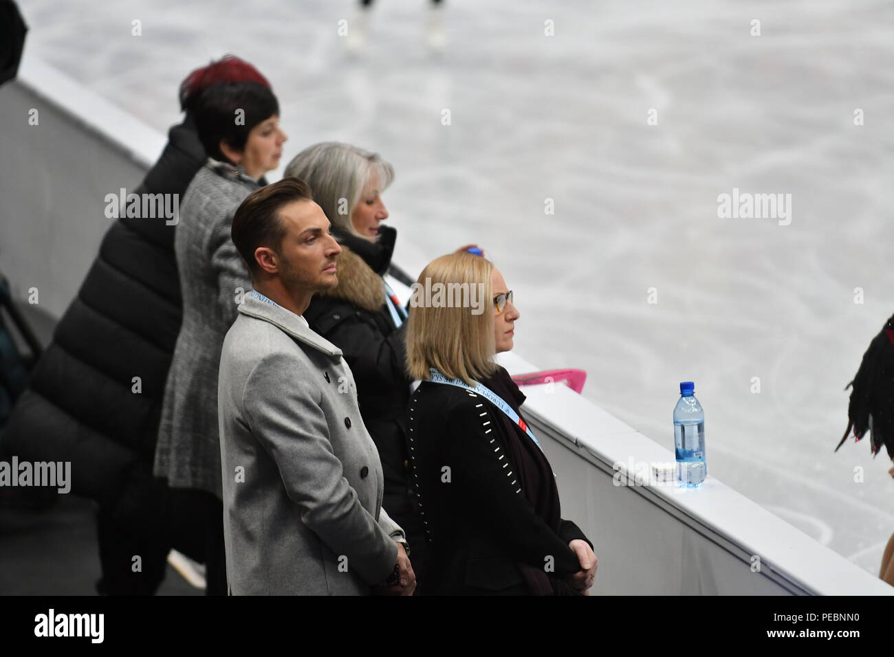 A group of figure skating coaches during warm up Stock Photo - Alamy