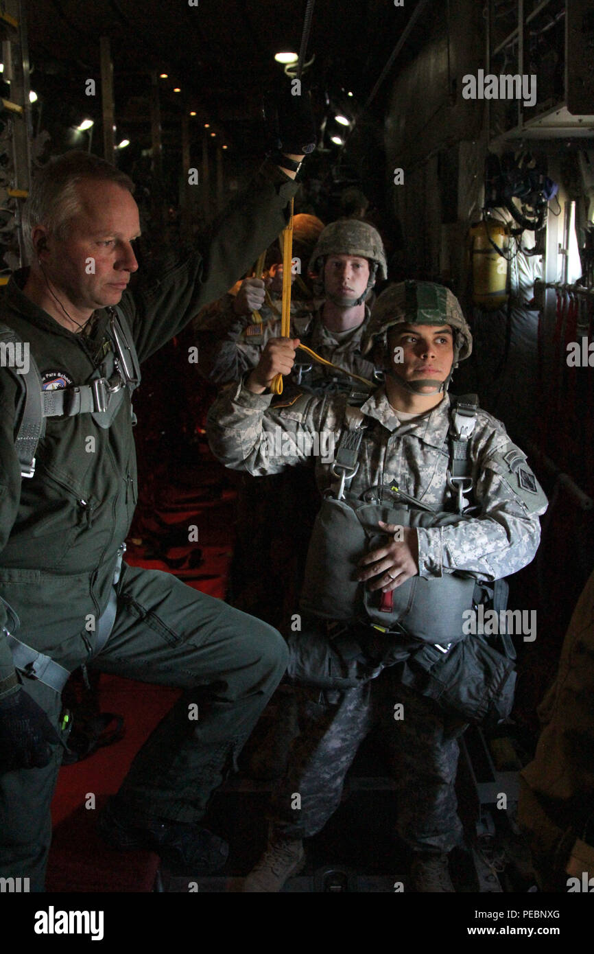 Dutch Jumpmaster Sgt. 1st Class Ruud Van Dillen, left, waits next to ...
