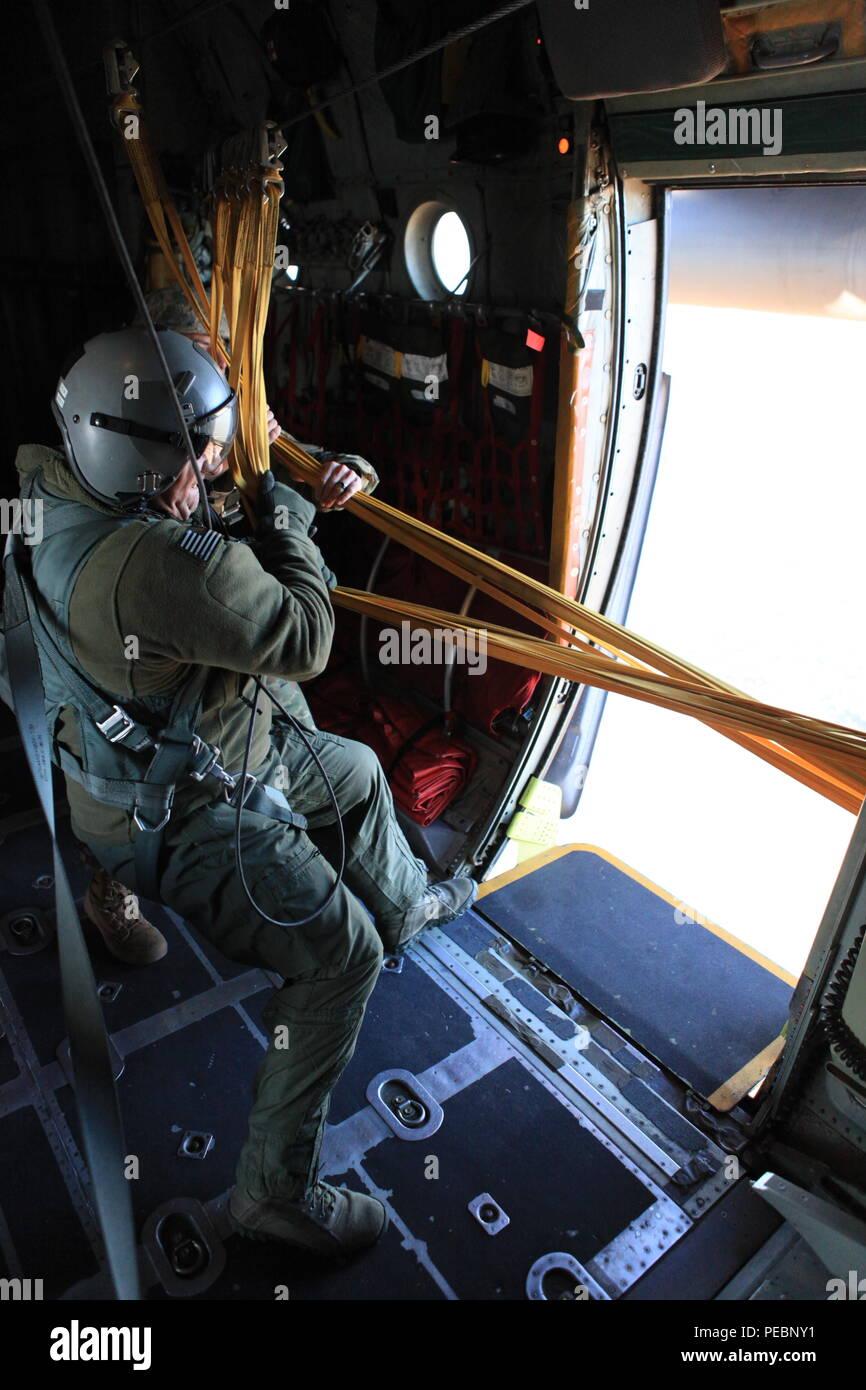 U.S. Air Force loadmaster pulls static lines into C-130 Aircraft after ...