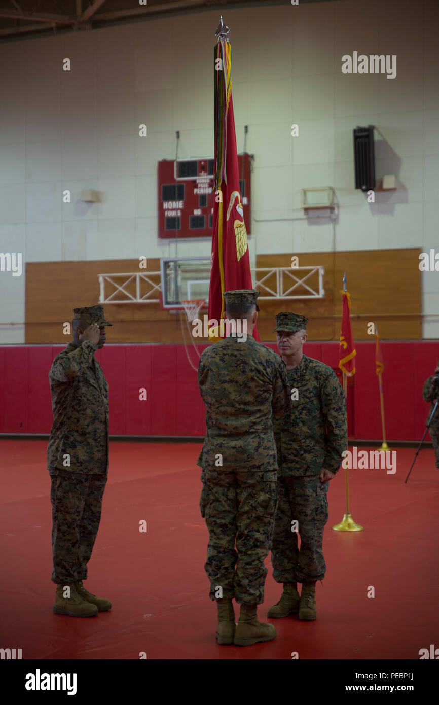 Brig. Gen. John M. Jansen, middle, accepts the Marine Corps flag and ...