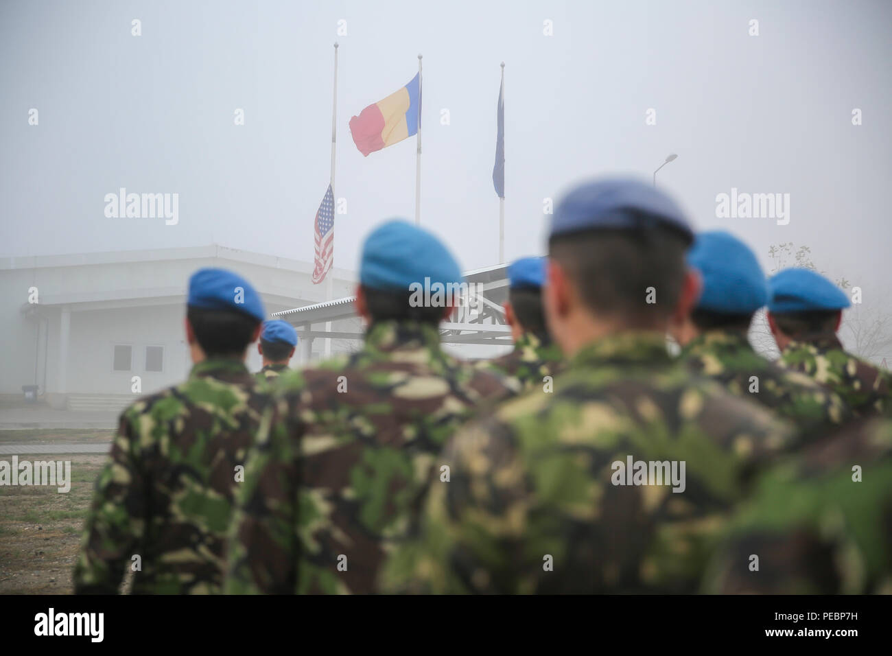 Romanian soldiers stand with U.S. Marines to commemorate the 74th ...